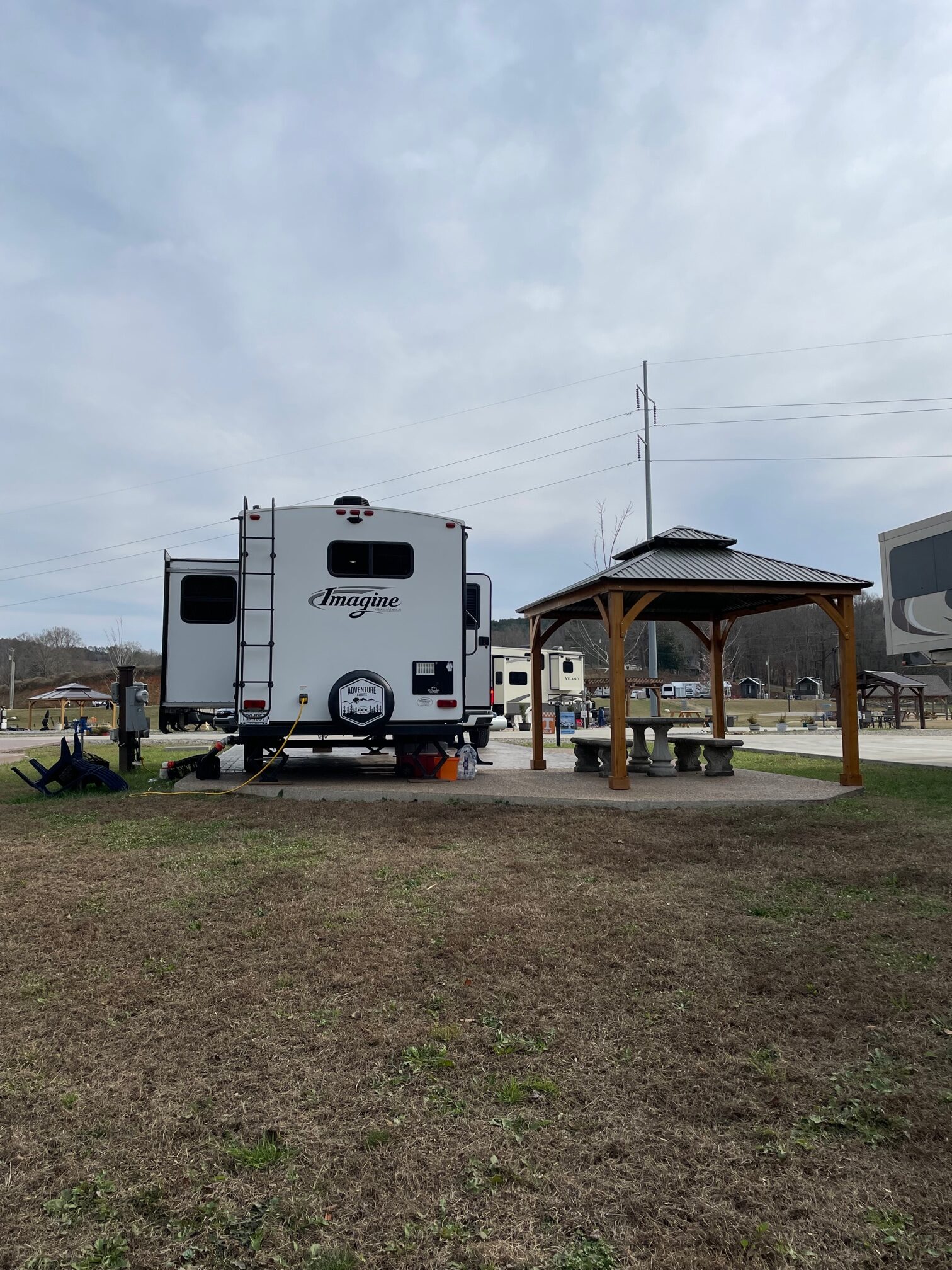 behind-lot-108-Waterside-RV-Resort | Imagine Camper